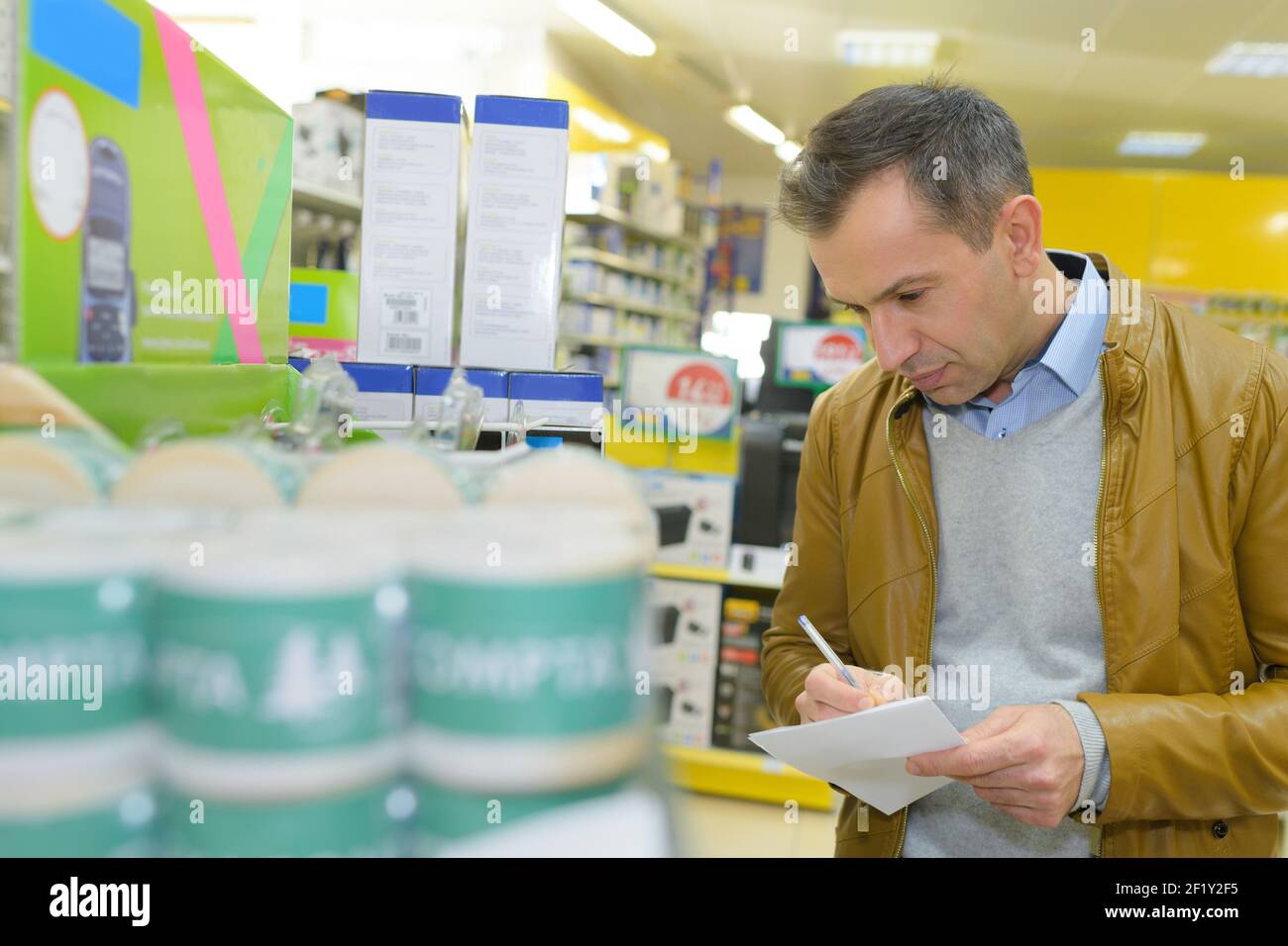 male client in a hardware store Stock Photo - Alamy