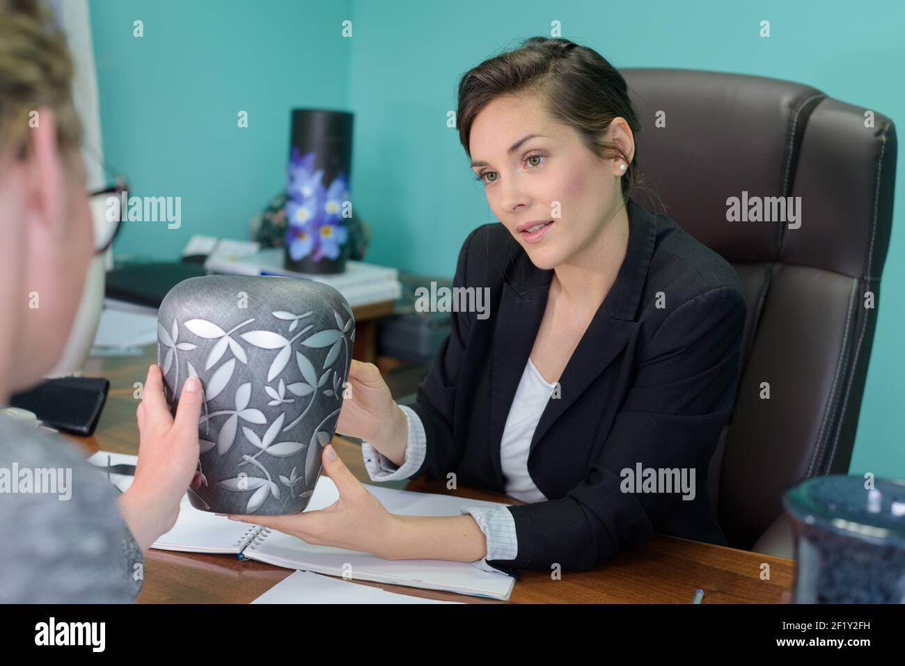 funeral director in meeting with customer Stock Photo - Alamy