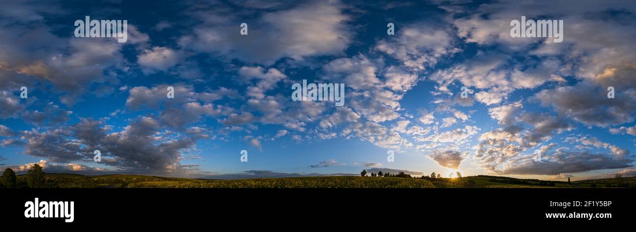 Cloudy sunset sky over fields hi-res stock photography and images - Alamy