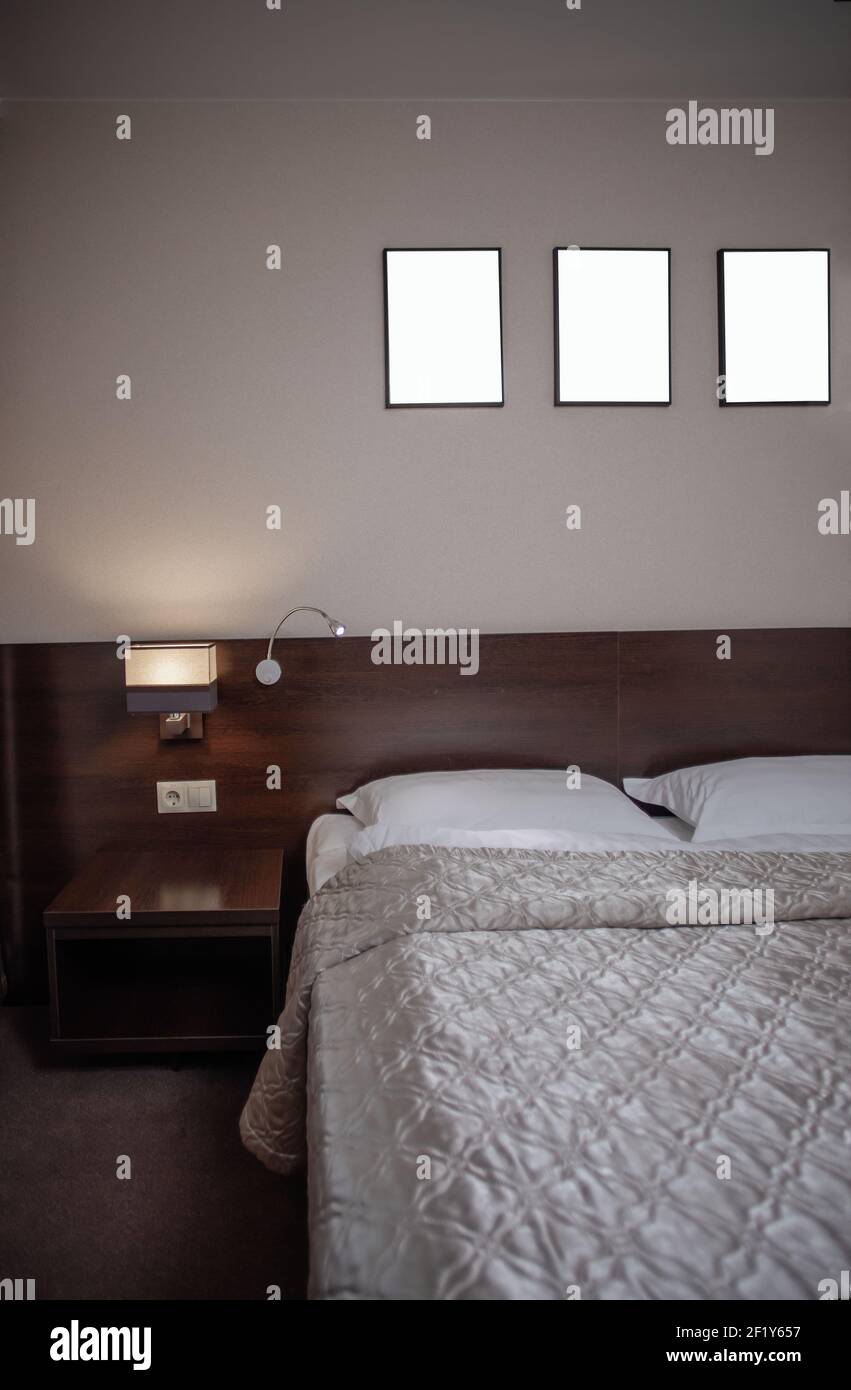 Interior of a comfortable hotel bedroom in the morning in luxury style ...