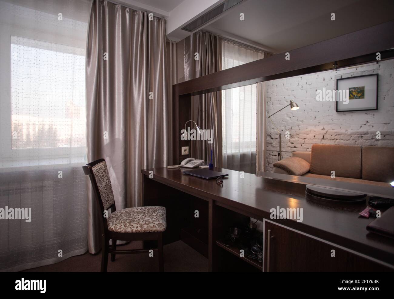 Interior of a comfortable hotel bedroom in the morning in luxury style ...