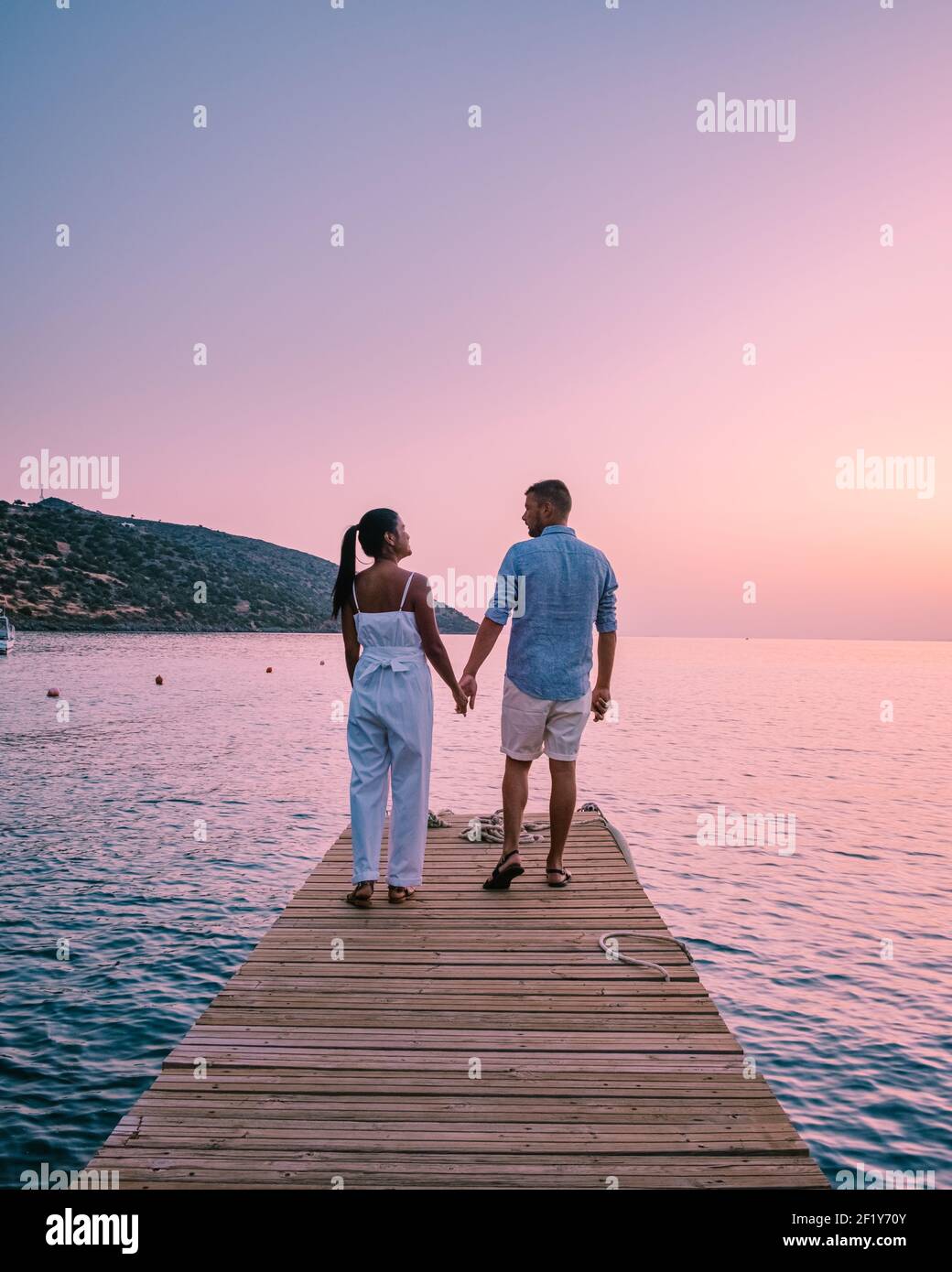 Crete Greece, young romantic couple in love is sitting and hugging on ...