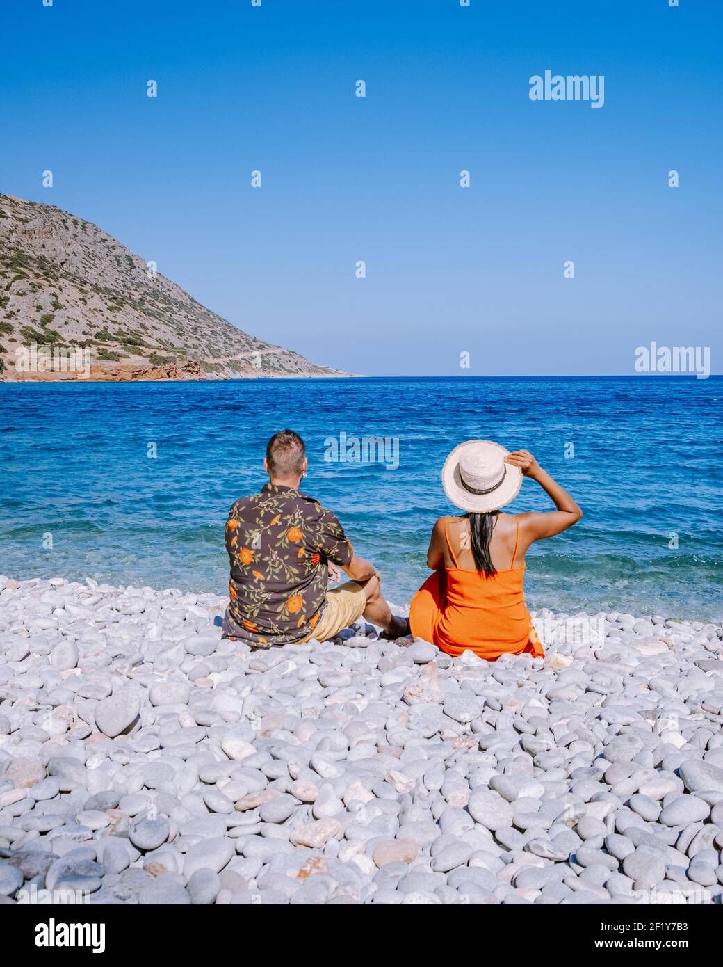 Plaka Lassithi with is traditional blue table and chairs and the beach ...