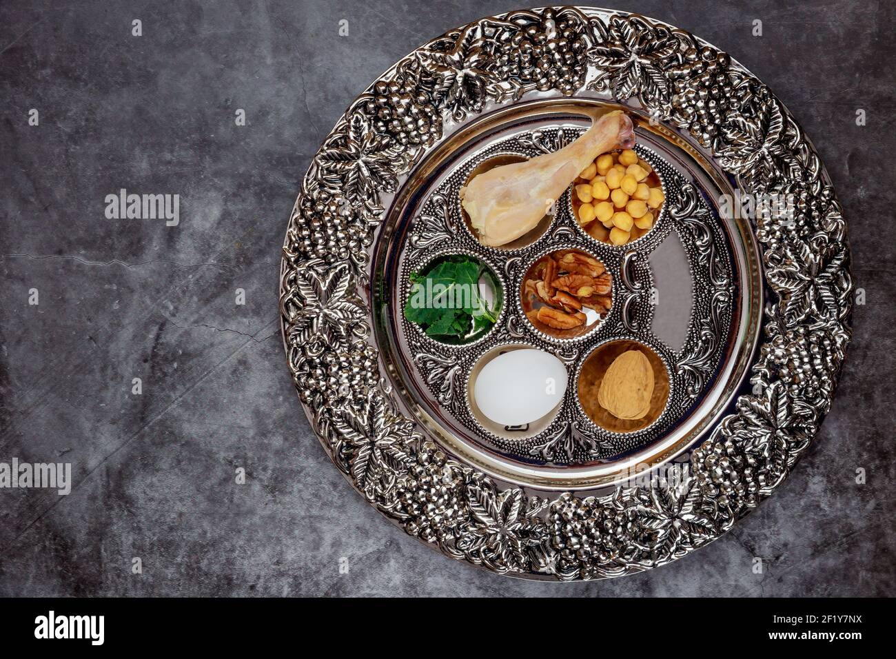 Jewish seder with egg, bone, herbs and walnut Passover holiday concept ...