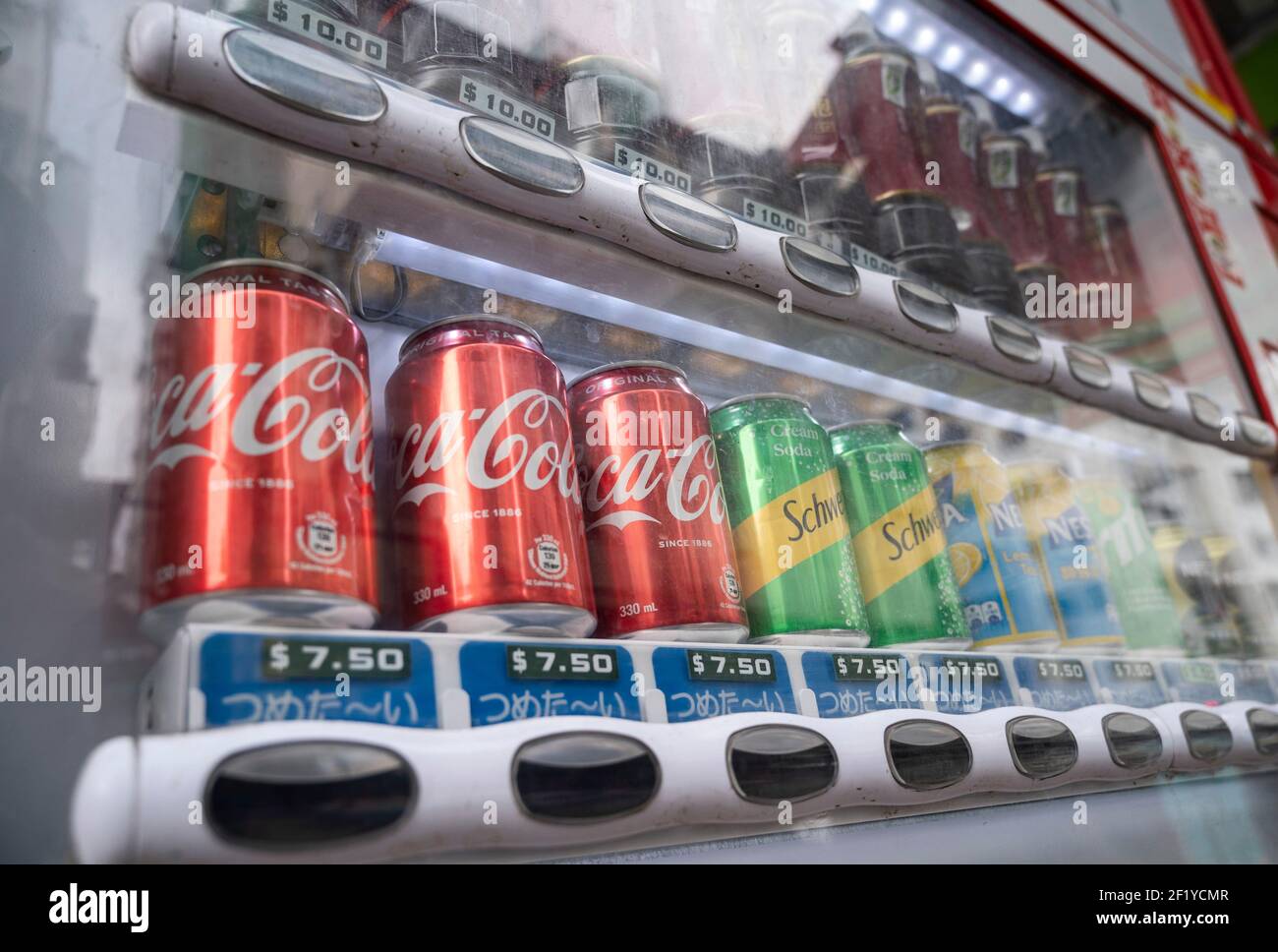 A beverage and soda, such as Coca-Cola, Nestea, Schweppes, vending machine seen in Hong Kong ...