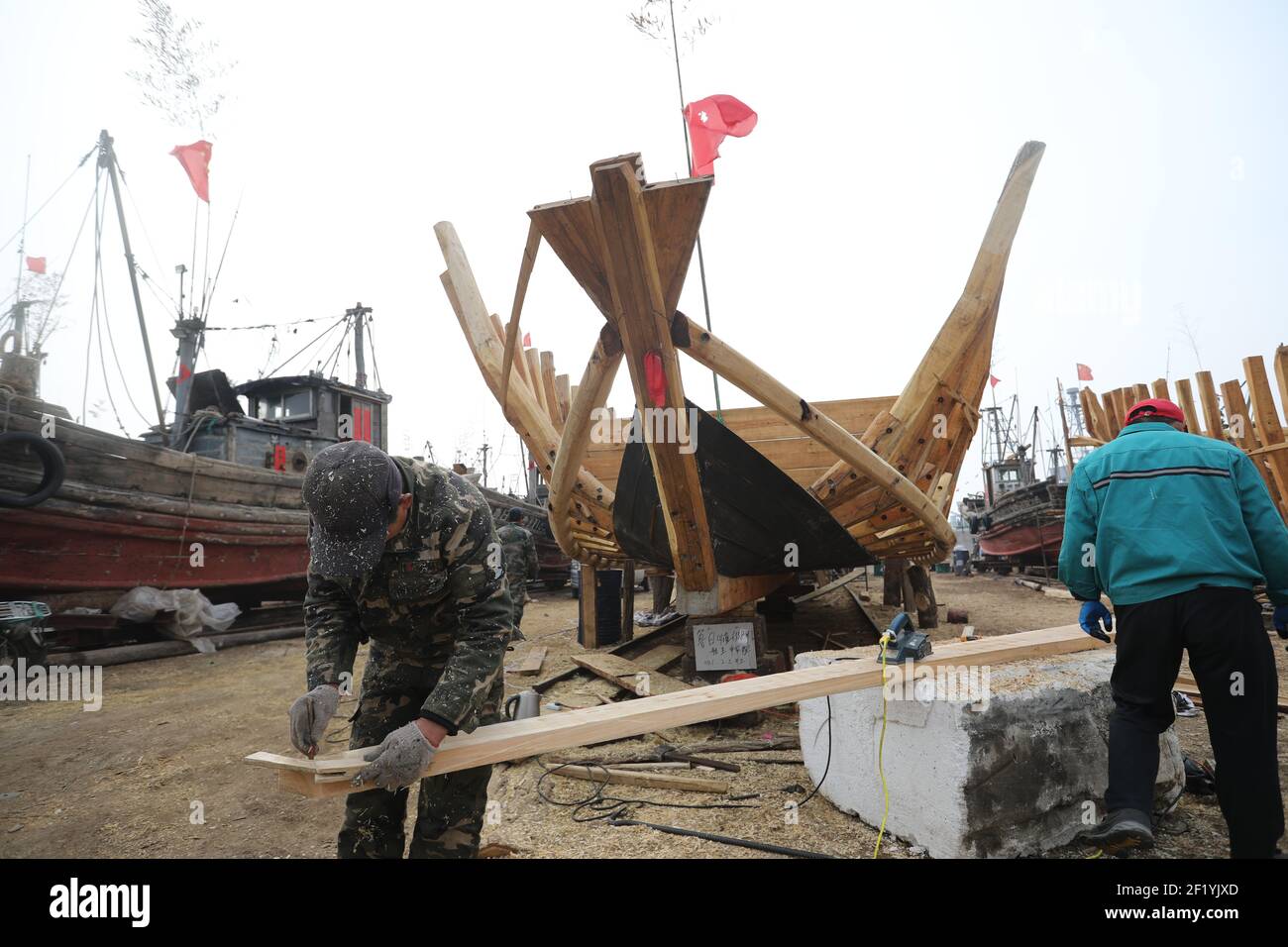 Row boat builders make a wooden row boat with traditional techniques at ...