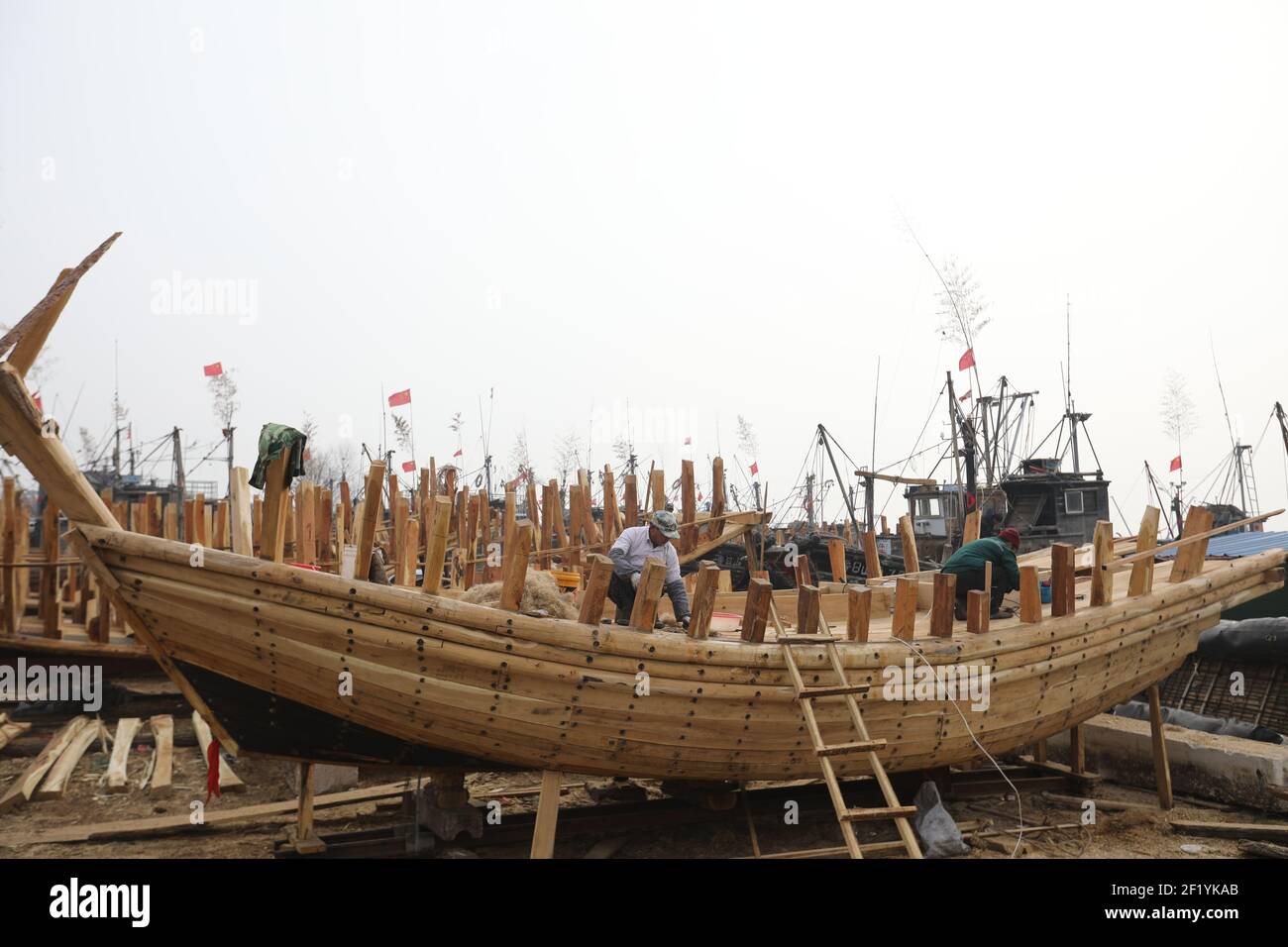 Row boat builders make a wooden row boat with traditional techniques at ...