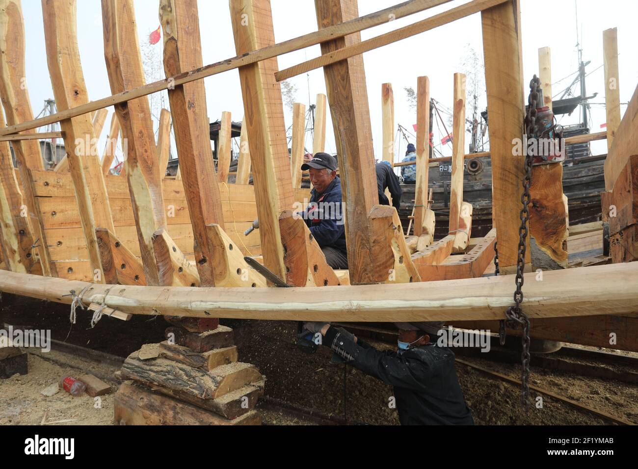 Row boat builders make a wooden row boat with traditional techniques at ...