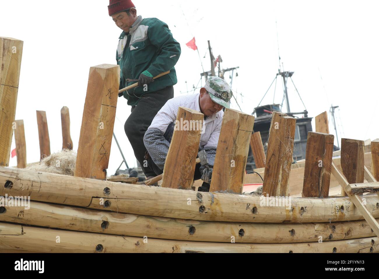 Row boat builders make a wooden row boat with traditional techniques at ...
