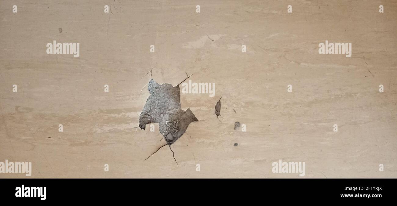 Broken wall texture with old paint. The consequences of the earthquake ...