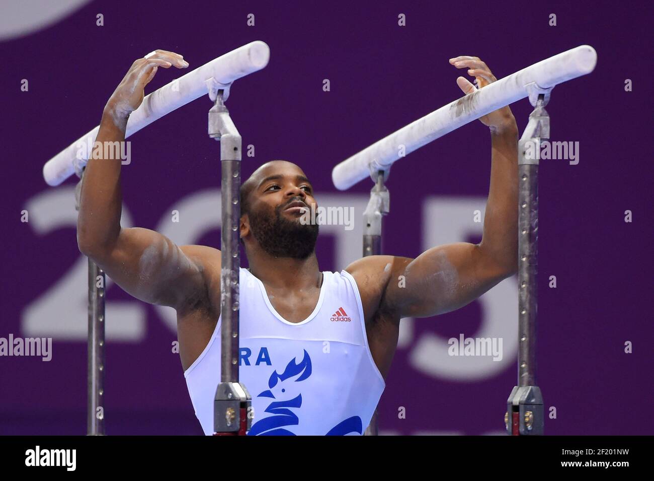 Axel Augis of France compete in Gymnastics Artistic Men's Parallel Bars ...