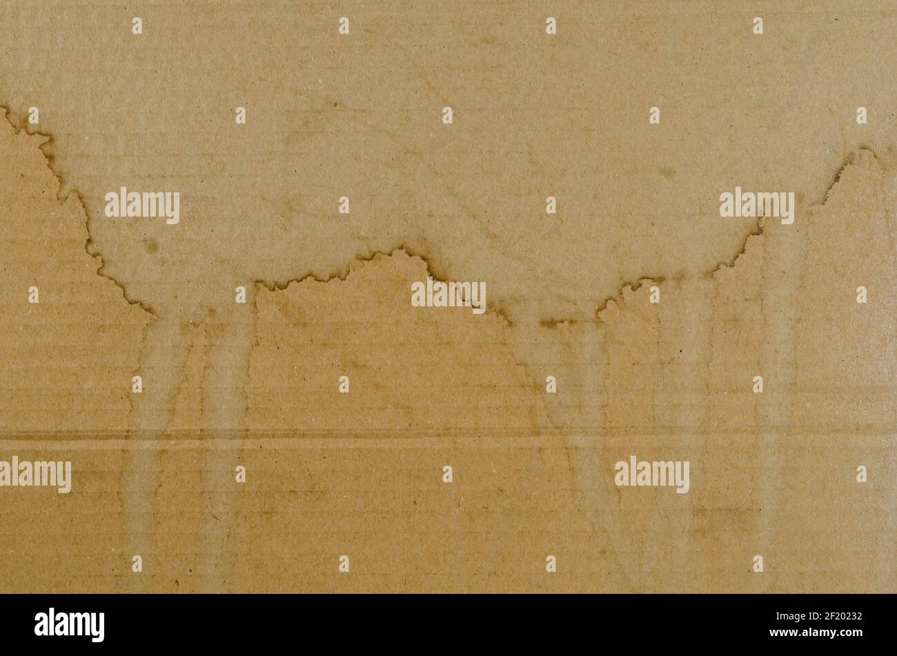 Dirty corrugated cardboard. Old, torn cardboard with streaks and stains ...