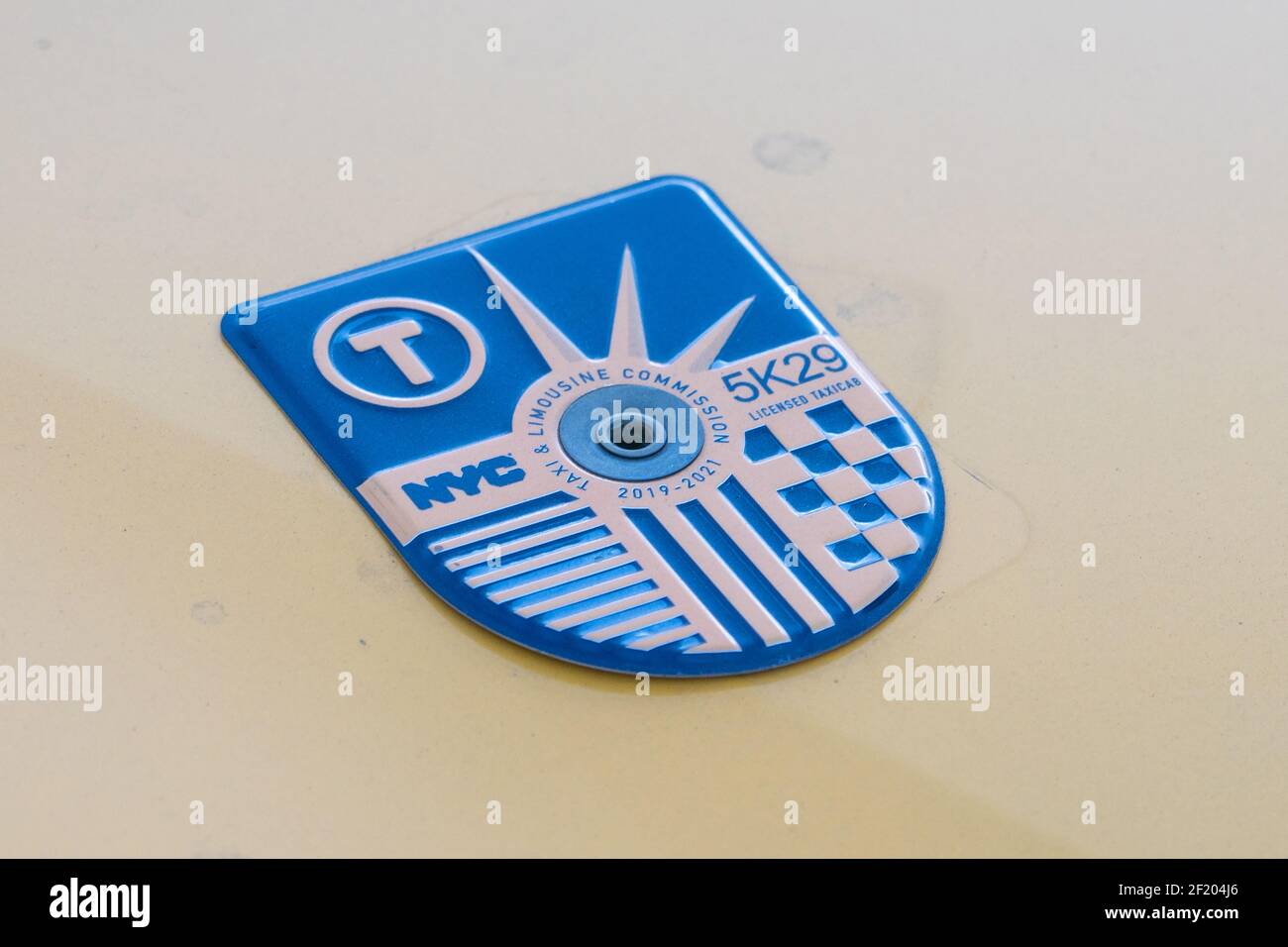 NEW YORK, NY – MARCH 9: A Taxi and Limousine Commission (TLC) medallion ...