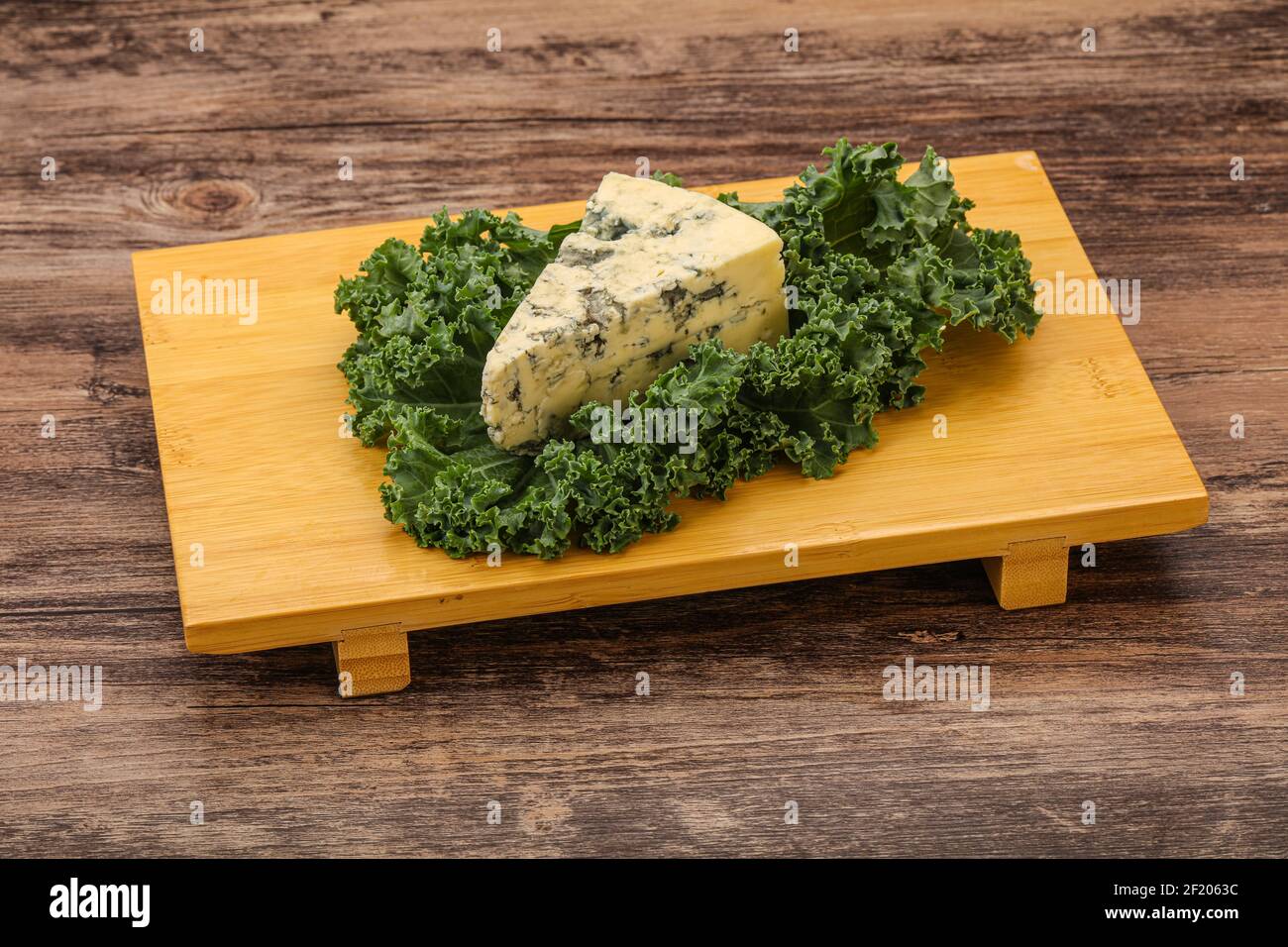 Dairy Blue cheese triangle with mold Stock Photo - Alamy