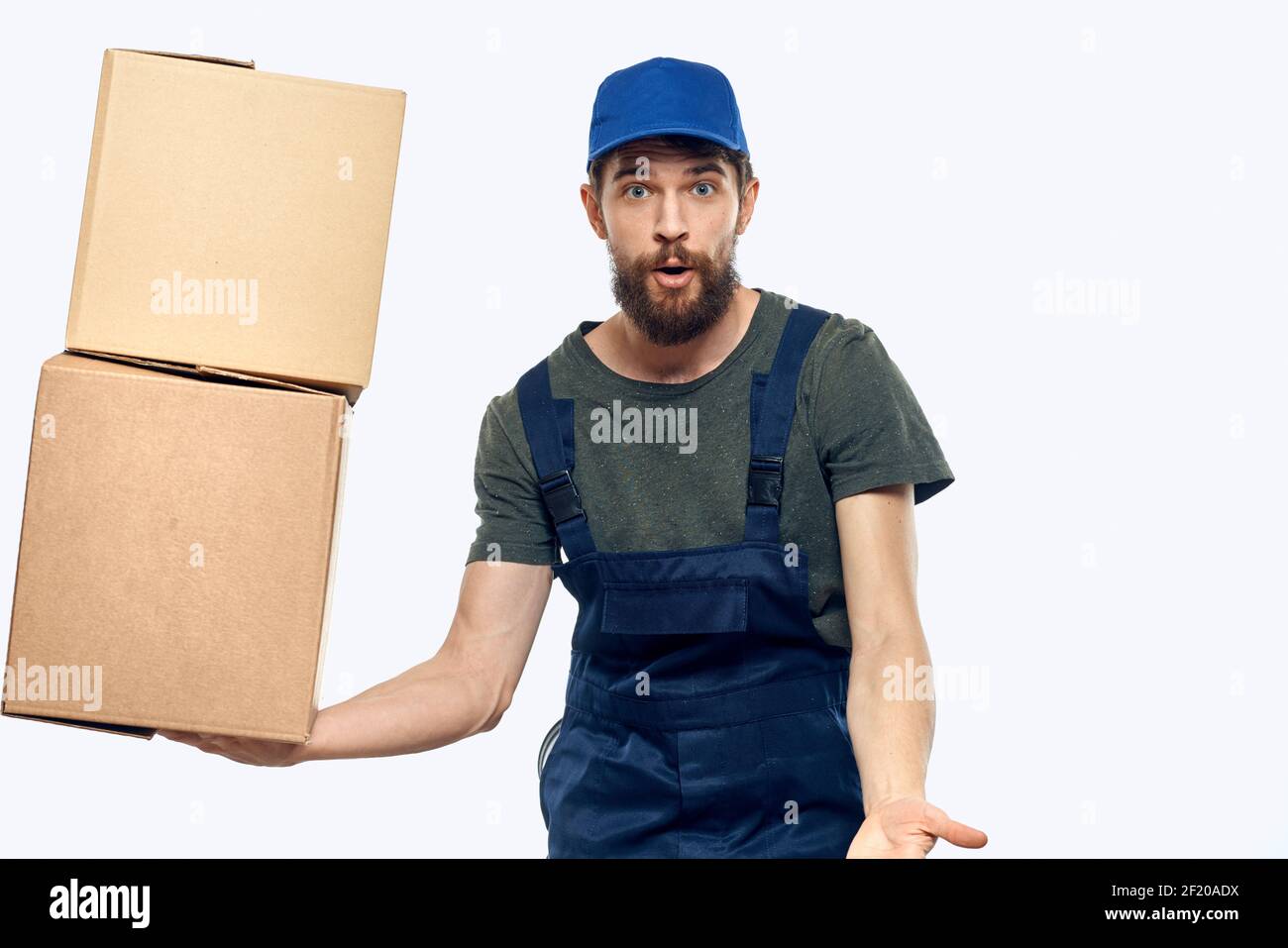 Man worker in uniform providing loading delivery service Stock Photo ...
