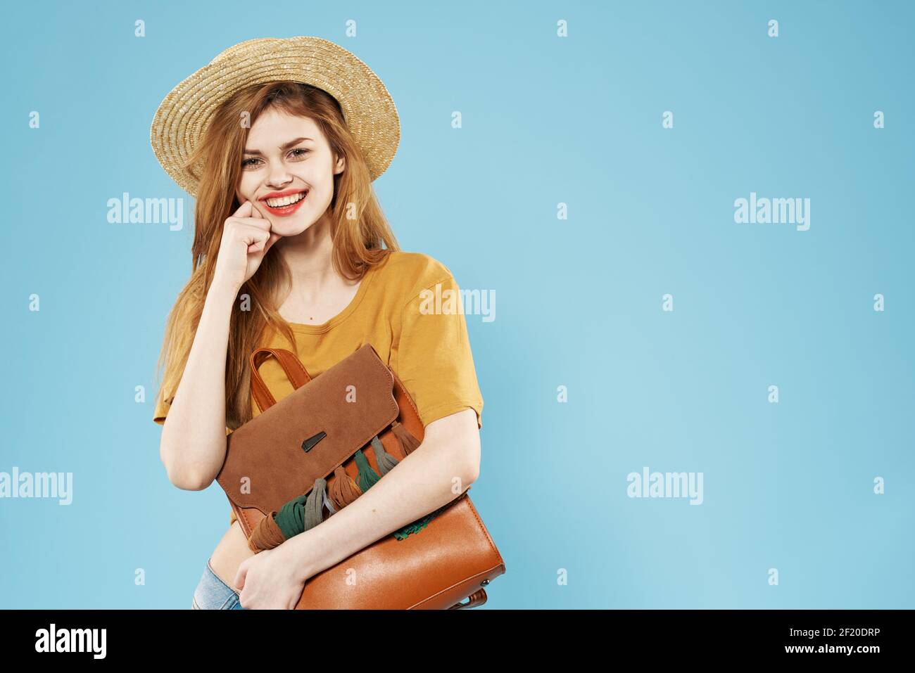 elegant woman hat backpack fashion studio charm models Stock Photo - Alamy