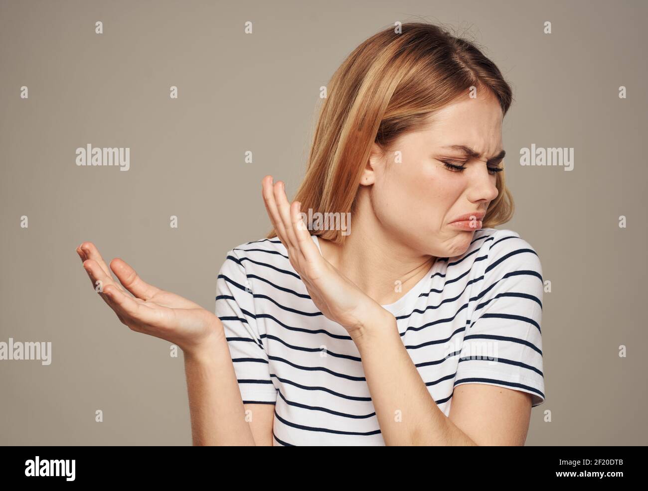 Upset woman model disgust emotions beige background portrait Stock ...