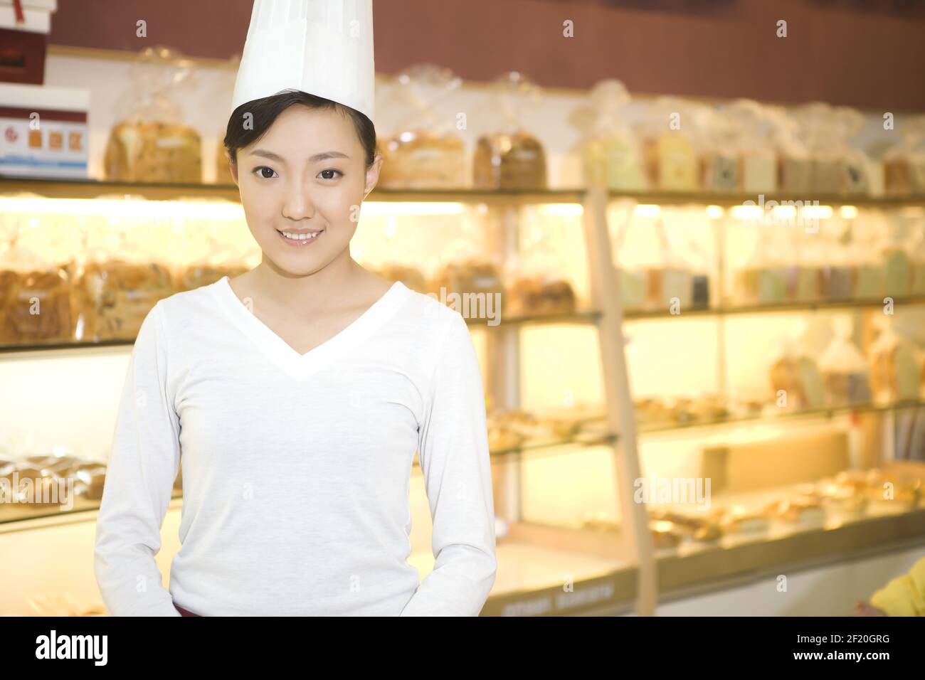 The happy bakery saleswoman is in the bakery Stock Photo - Alamy