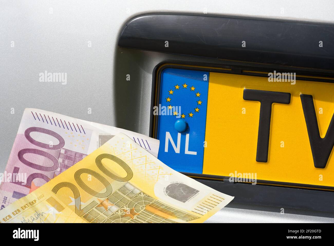 A car with Dutch registration and euro banknotes Stock Photo - Alamy