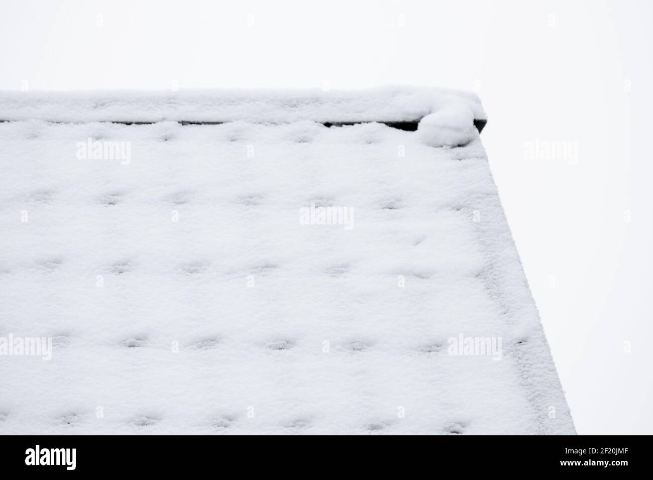 Rooftop covered with snow under white winter sky, abstract photo Stock ...