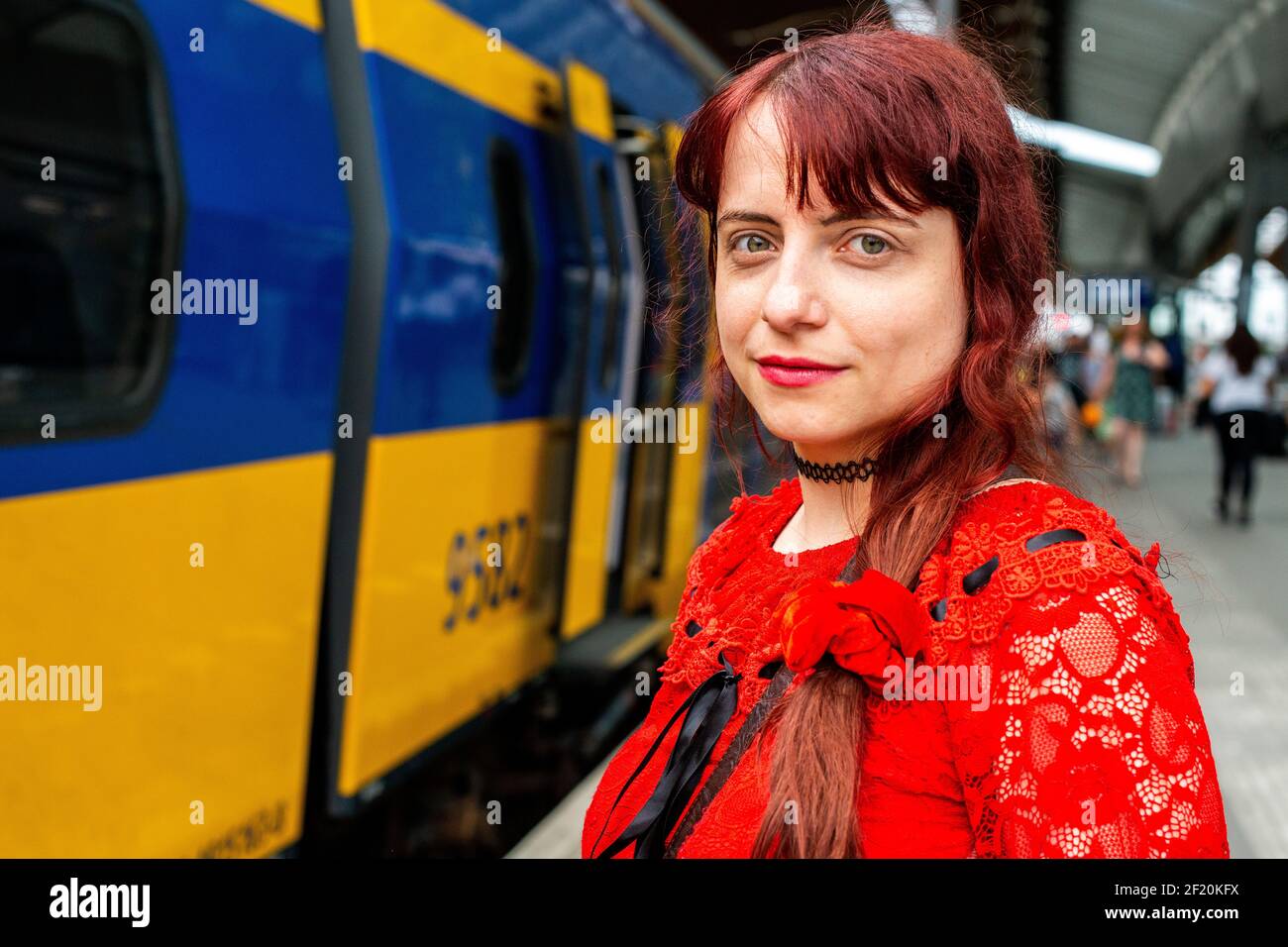 Amsterdam, Netherlands. Young, redhaired woman getting on a Dutch ...