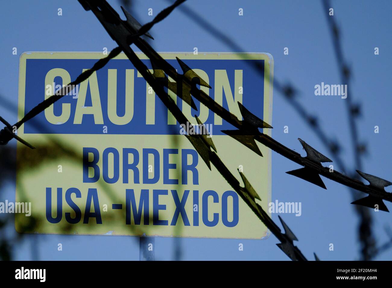 Barbed wire and border between USA and Mexico Stock Photo - Alamy