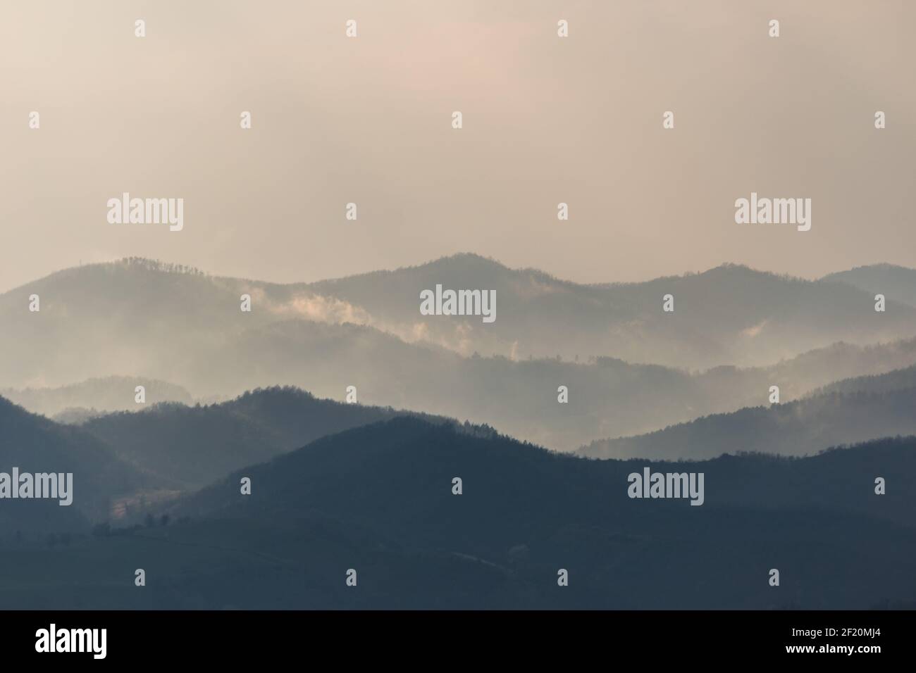 Mist and fog between valley and layers of mountains and hills in Umbria ...