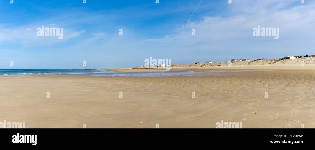 Wide empty beach and sand dunes on the Atlantic Ocean coast in France ...