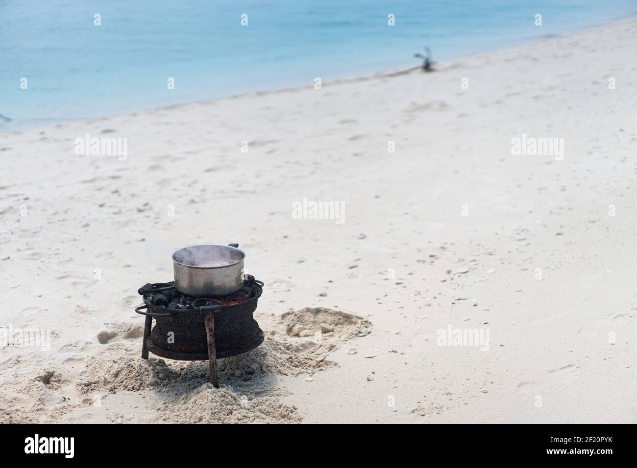 Having joy on beach sand making the food Stock Photo - Alamy