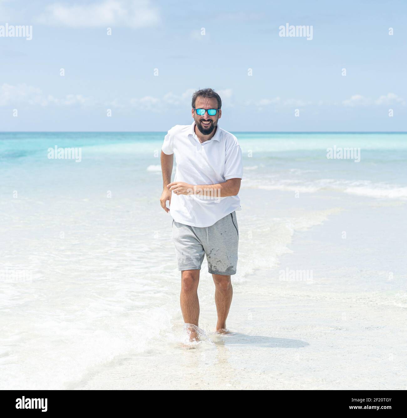 One man is enjoying beautiful tropical beach Stock Photo - Alamy