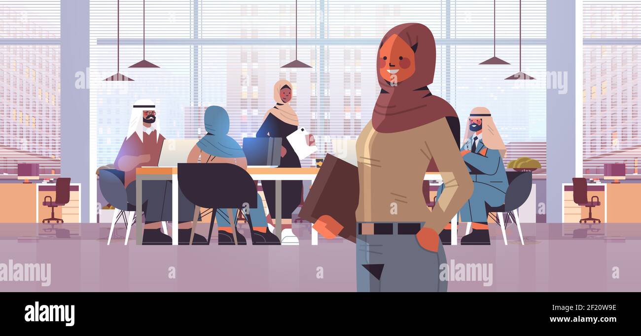 arab businesswoman leader standing in front of arabic businesspeople ...