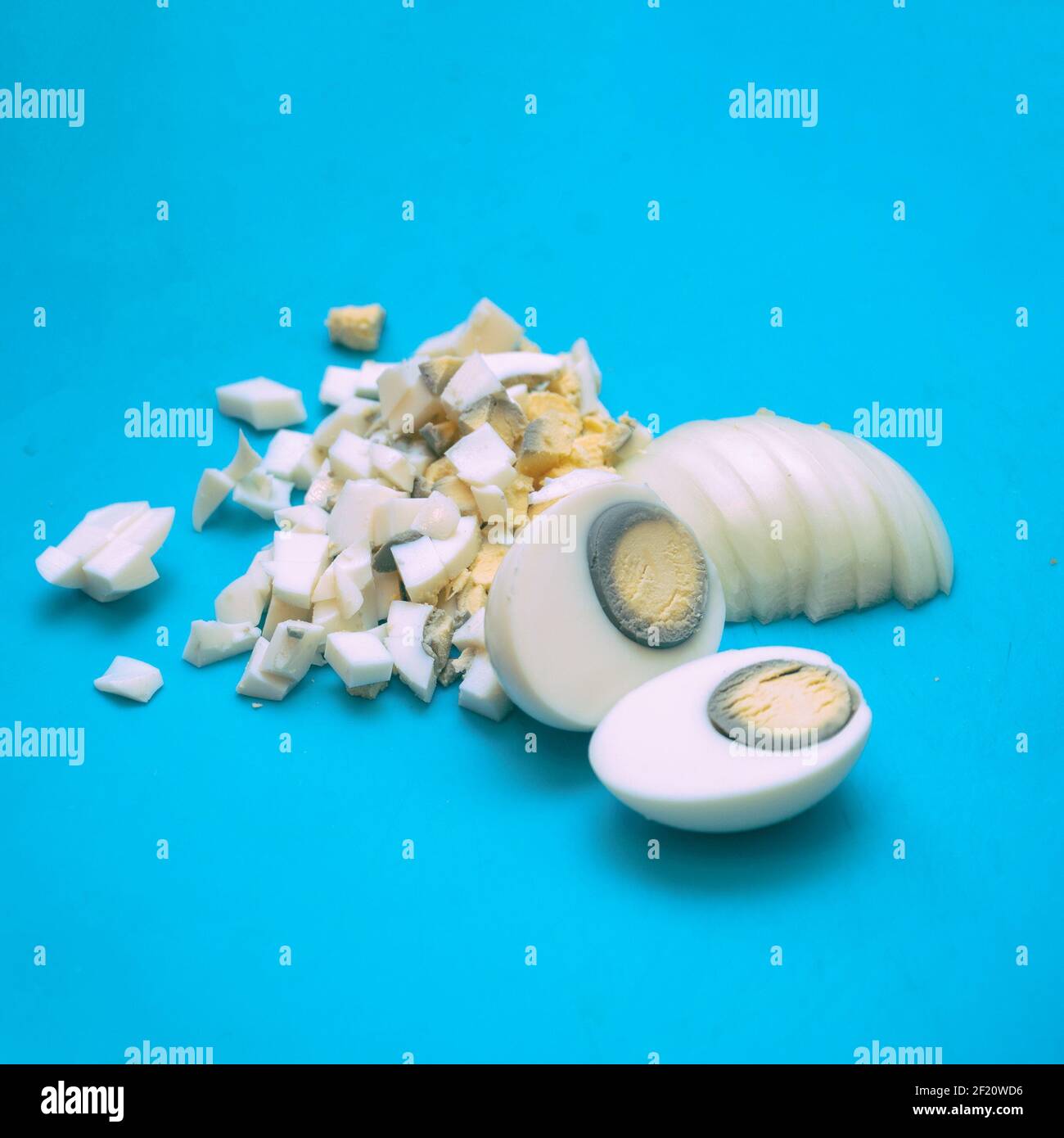Boiled eggs cut or chopped into small pieces on a cutting Board Stock ...