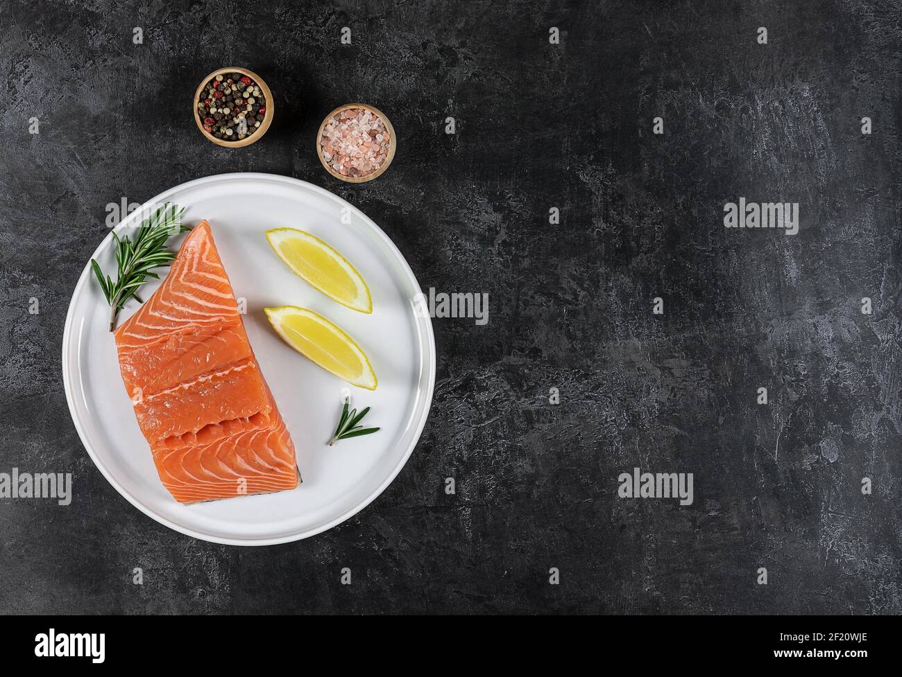 Fresh raw Atlantic salmon on the plate. Great source of omega-3 fatty ...