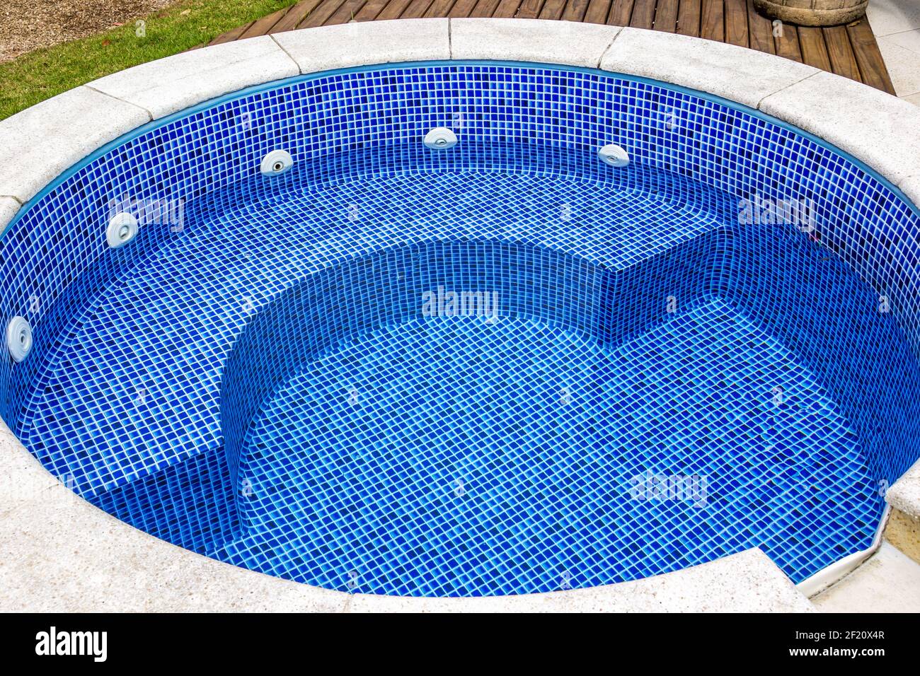 An illustration of a round blue pool in a garden Stock Photo - Alamy