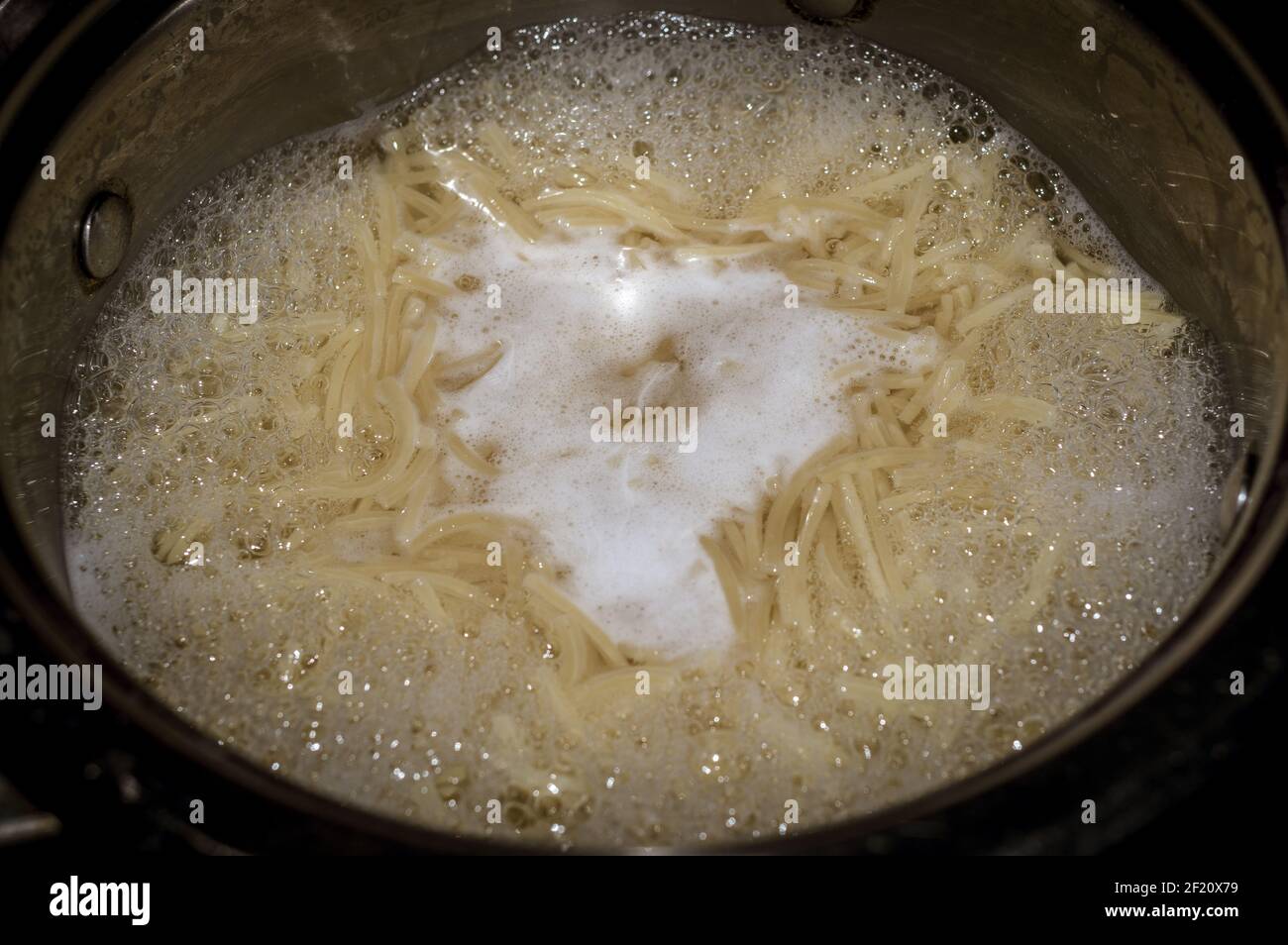A high angle shot of homemade noodles boiling in a pot Stock Photo - Alamy