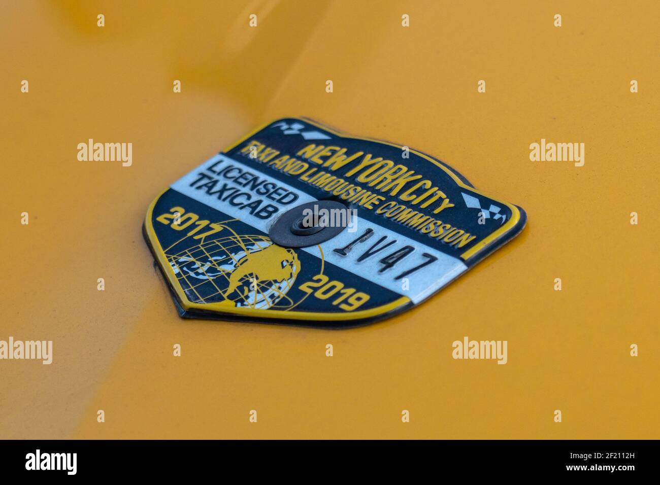 A Taxi and Limousine Commission (TLC) medallion seen on a parked New ...