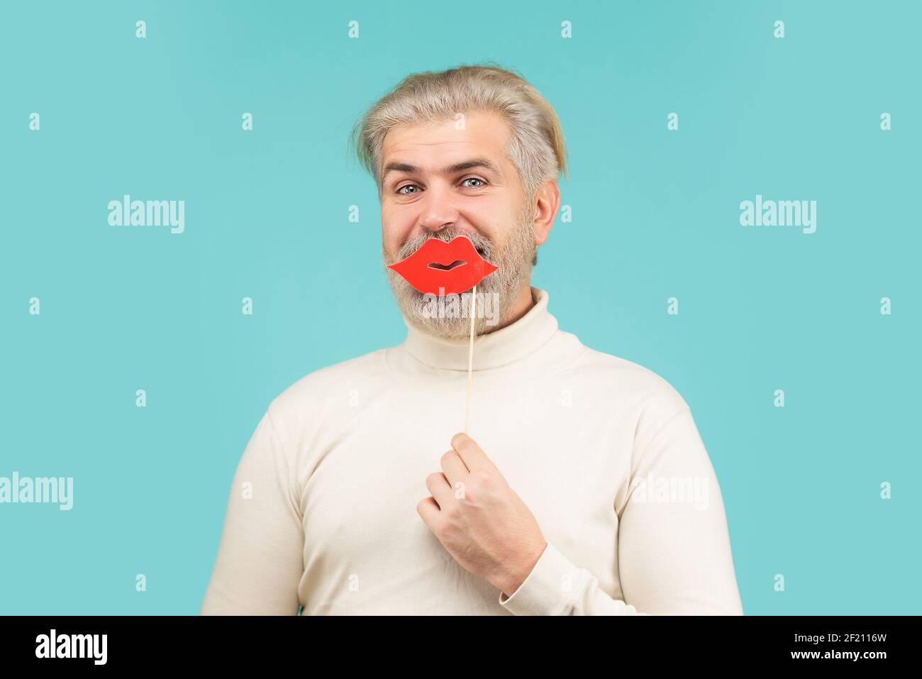 Photo booth concept. Man holding party lips. Bearded man with ...