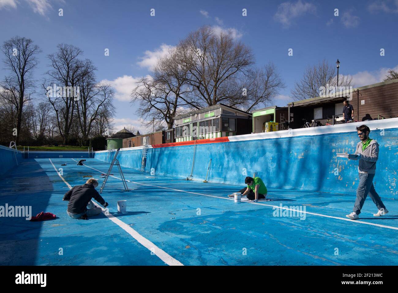 Members of staff paint the inside of the pool at Jesus Green Lido in ...