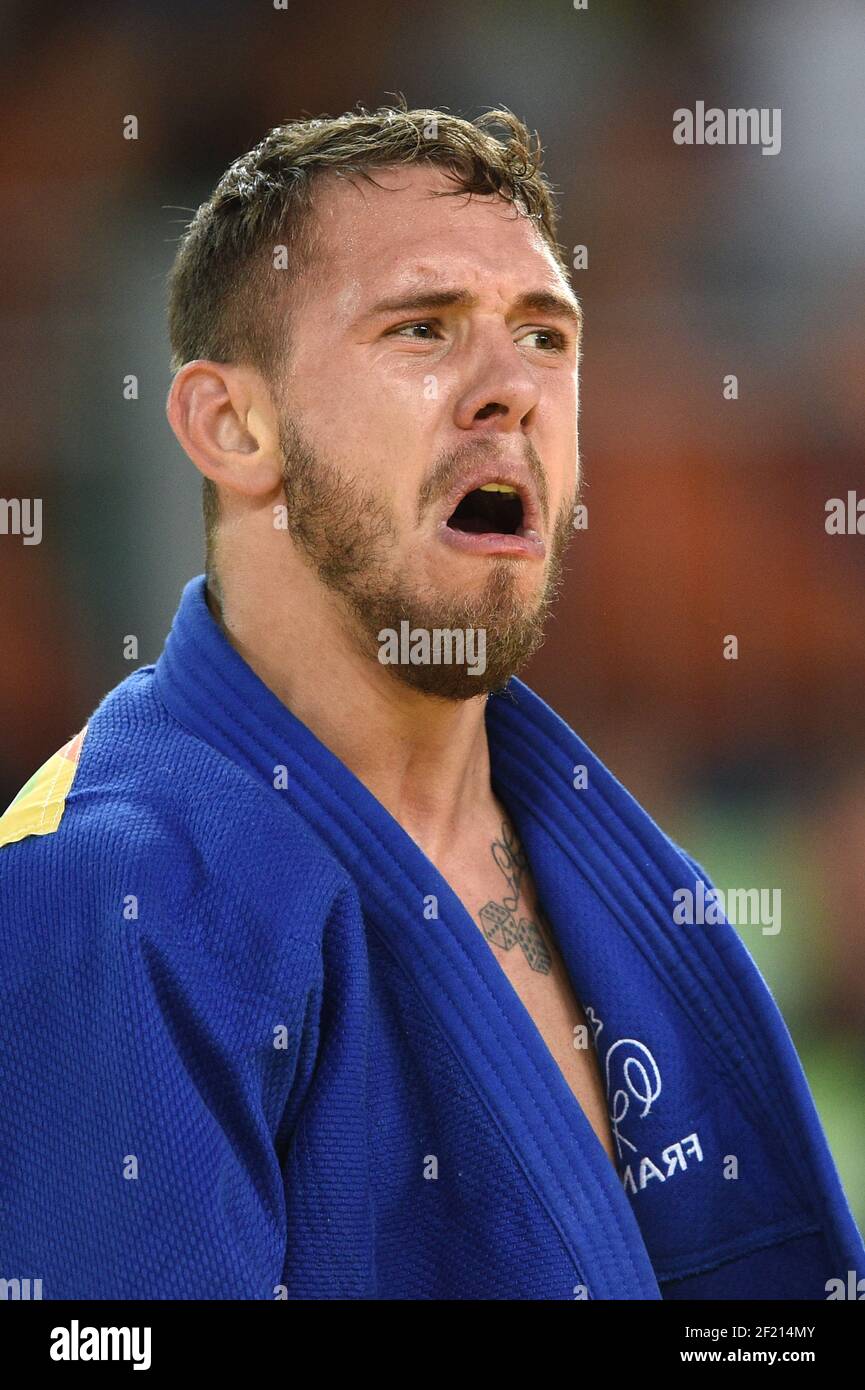 France's Loic Pietri reacts after his defeat against Canada's Antoine ...
