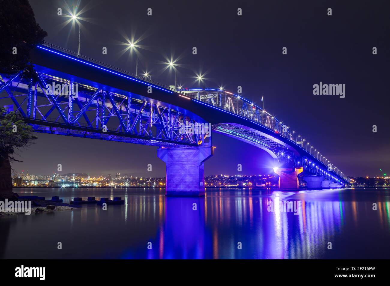 The Auckland Harbour Bridge, Auckland, New Zealand, colorfully lit up ...