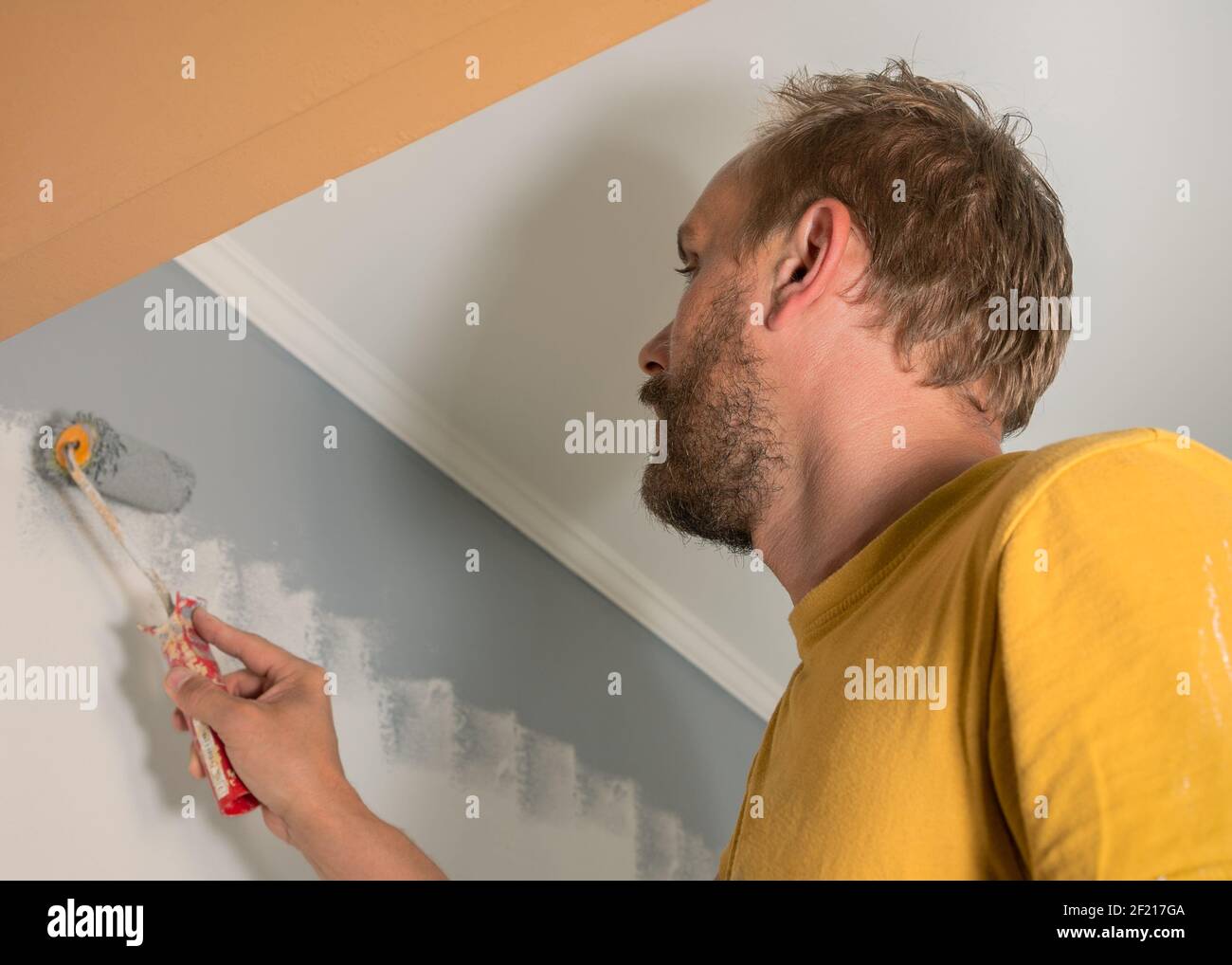 Workman is repairing room, real job Stock Photo - Alamy