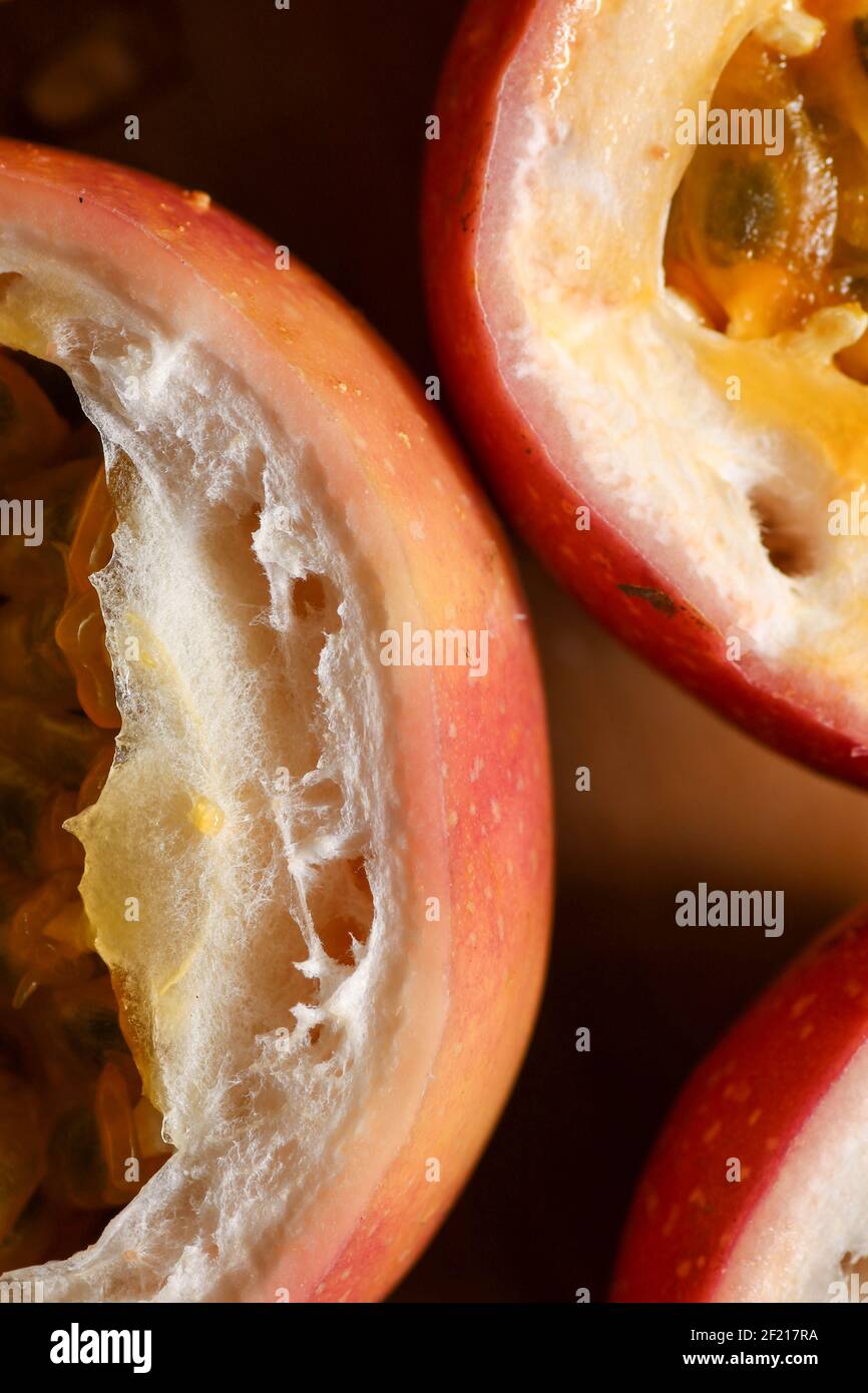 Half cut passion fruit on wooden background. Fresh passion fruits ...