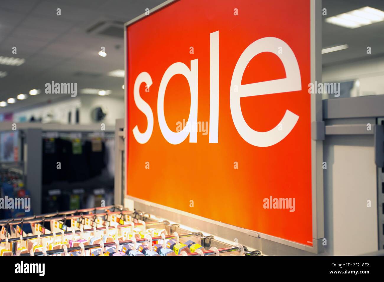 Sale sign text in clothing store marketplace, shopping in the mall ...