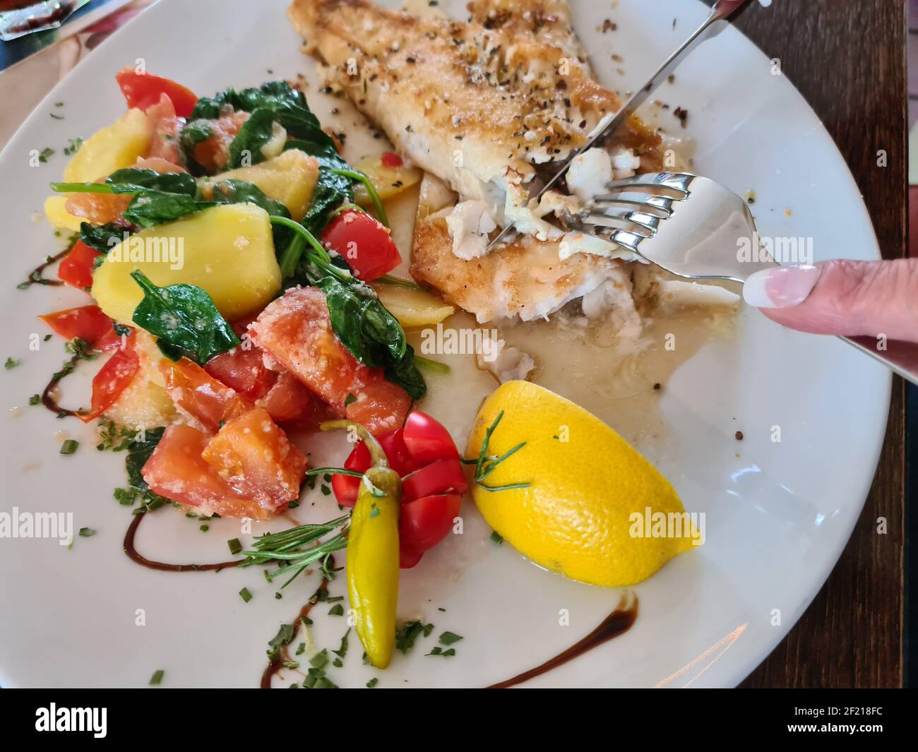 Pike perch fillet with asparagus, broccoli and carrots. Fried fish with ...