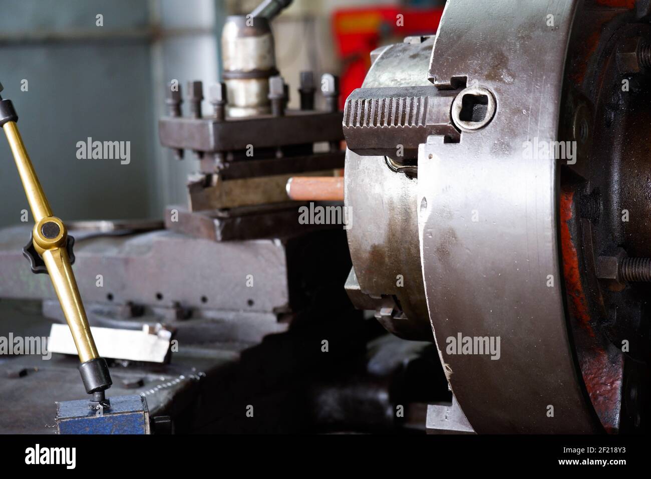 Professional tool technician A landscape of a man using a lathe. Metal ...