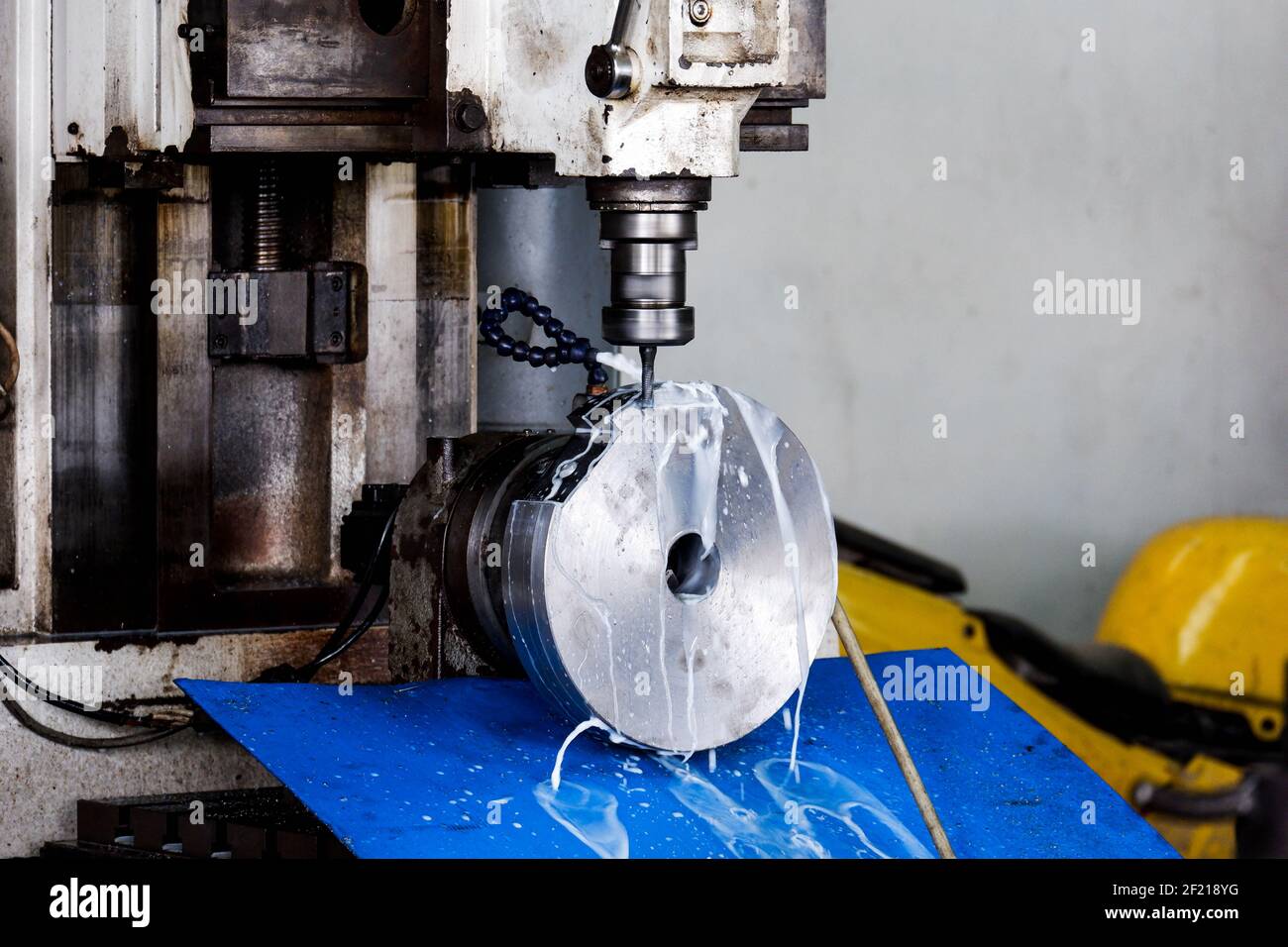 Professional tool technician A landscape of a man using a lathe. Metal ...