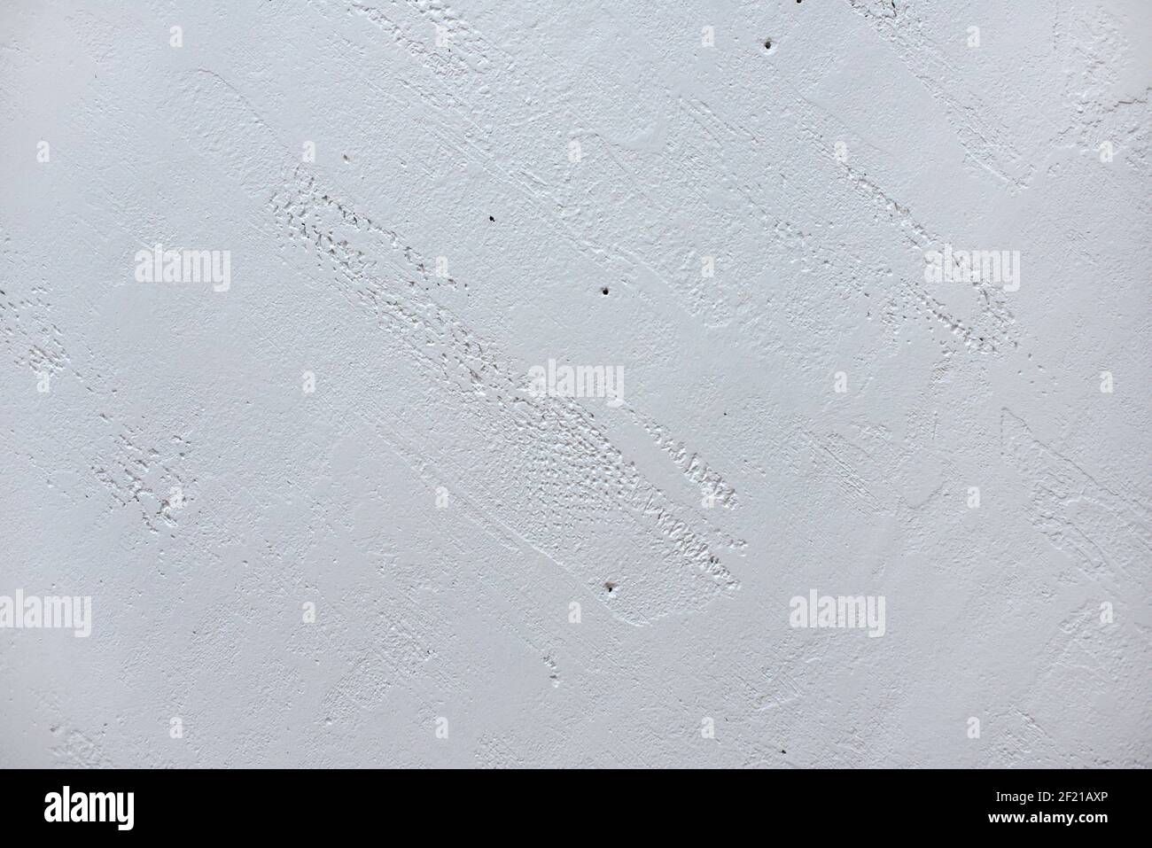 Wall with white rough plaster. Loft-style background Stock Photo - Alamy