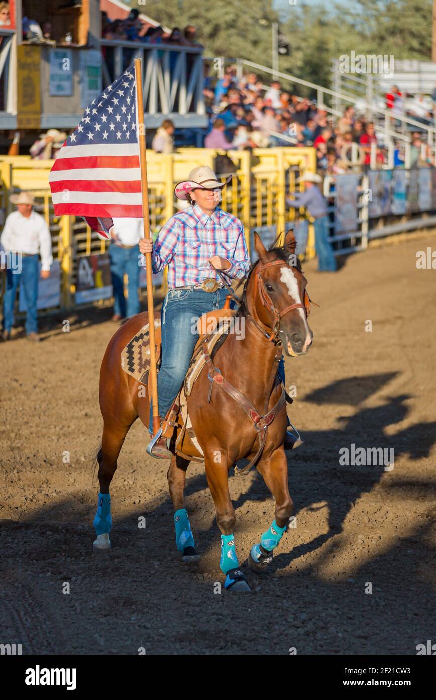 Color guard with American flag at the opening ceremonies of a rodeo ...
