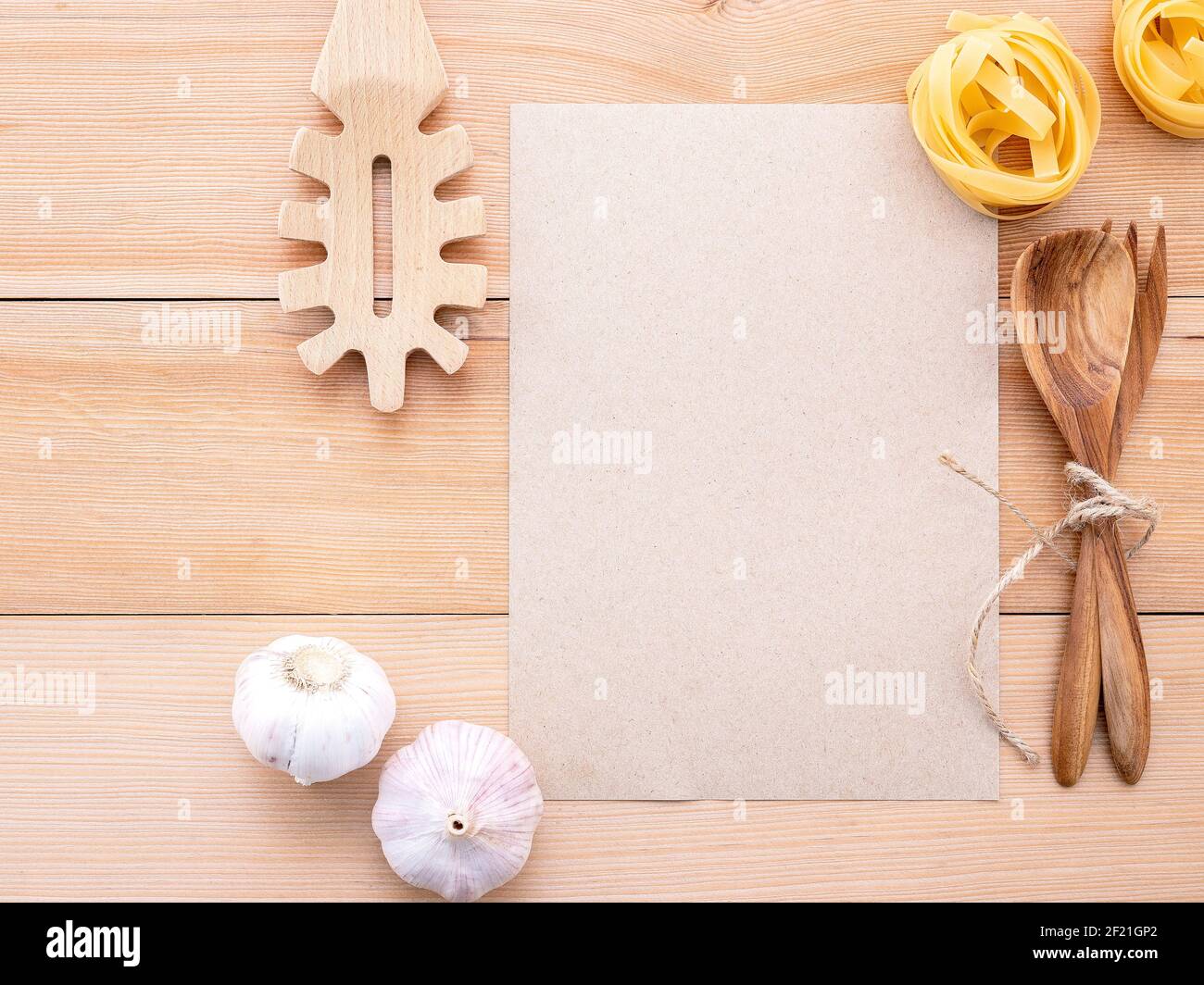 Italian foods concept and menu design . Blank paper and pasta ladle on ...