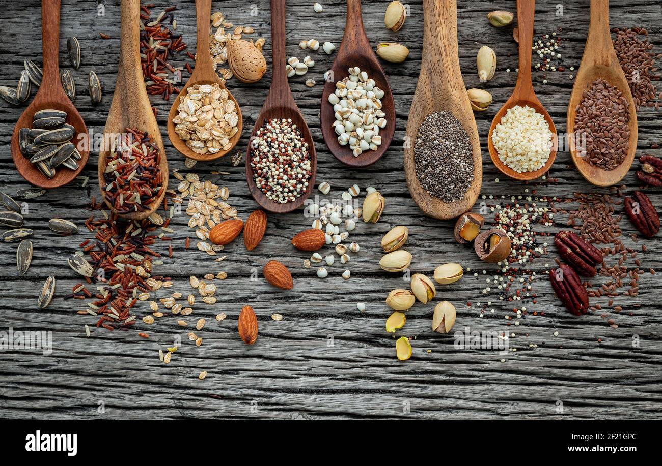 Different types of grains and cereals on shabby wooden background Stock ...